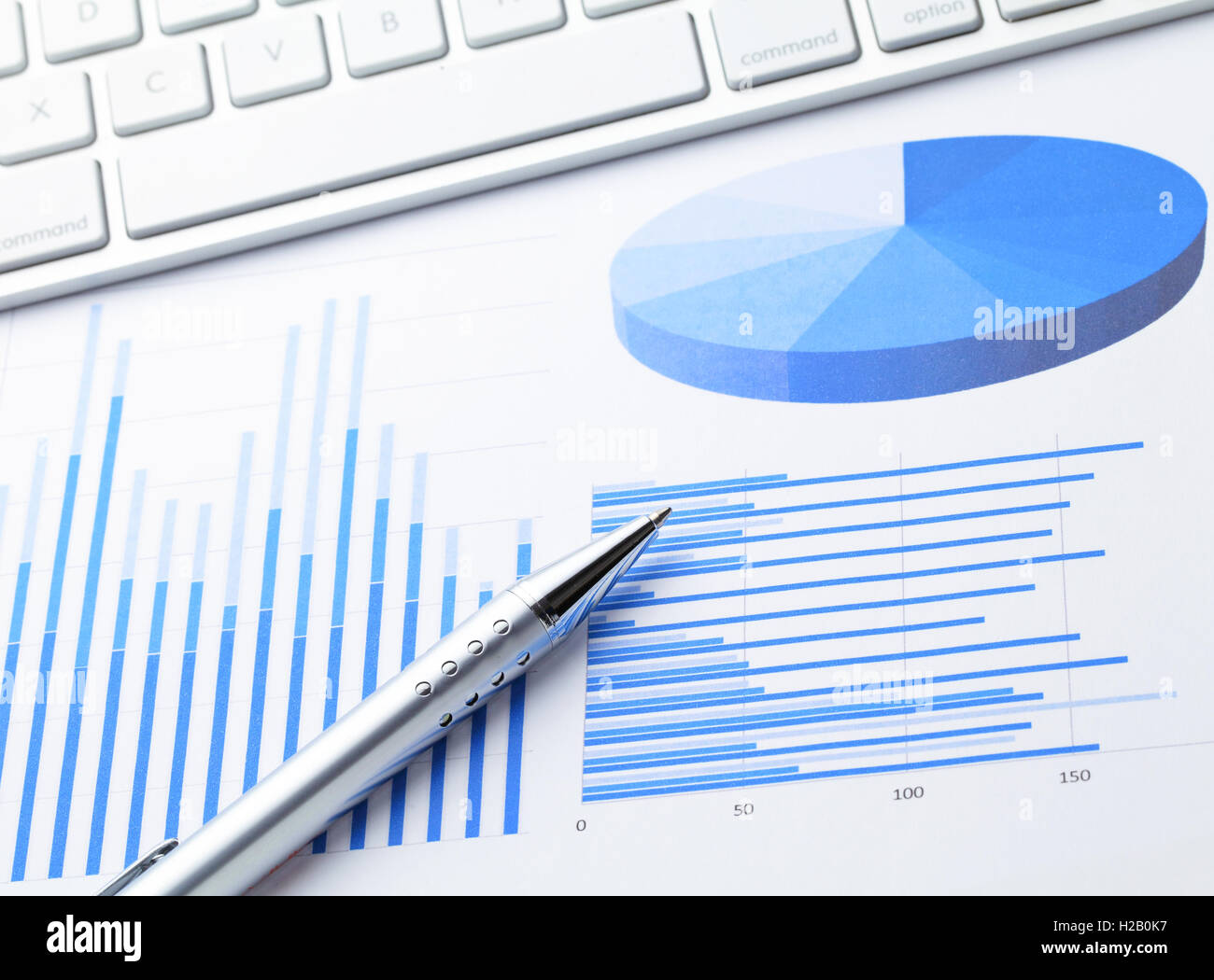 Business chart with computer keyboard Stock Photo - Alamy