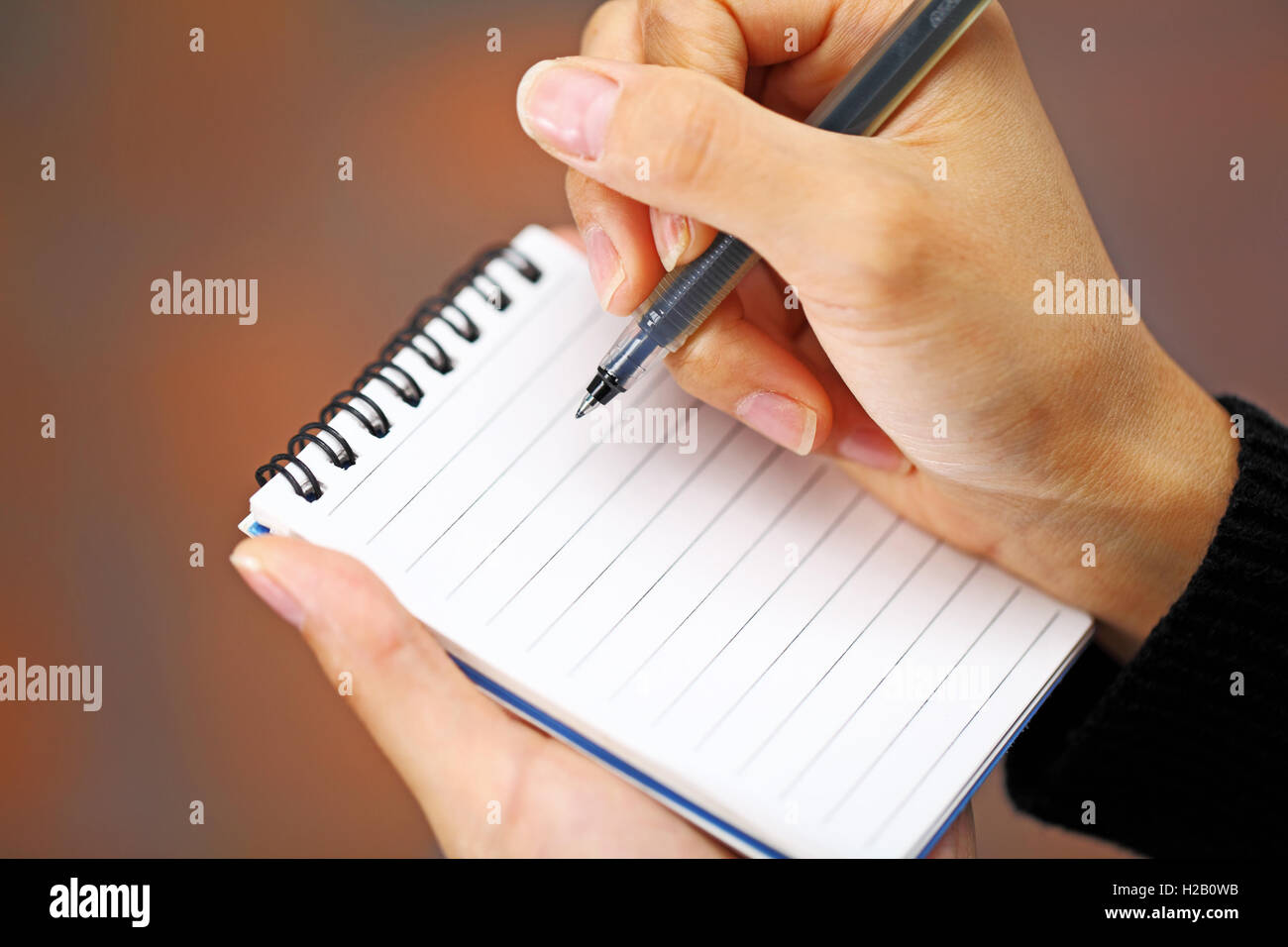 Pen in hand writing Stock Photo - Alamy