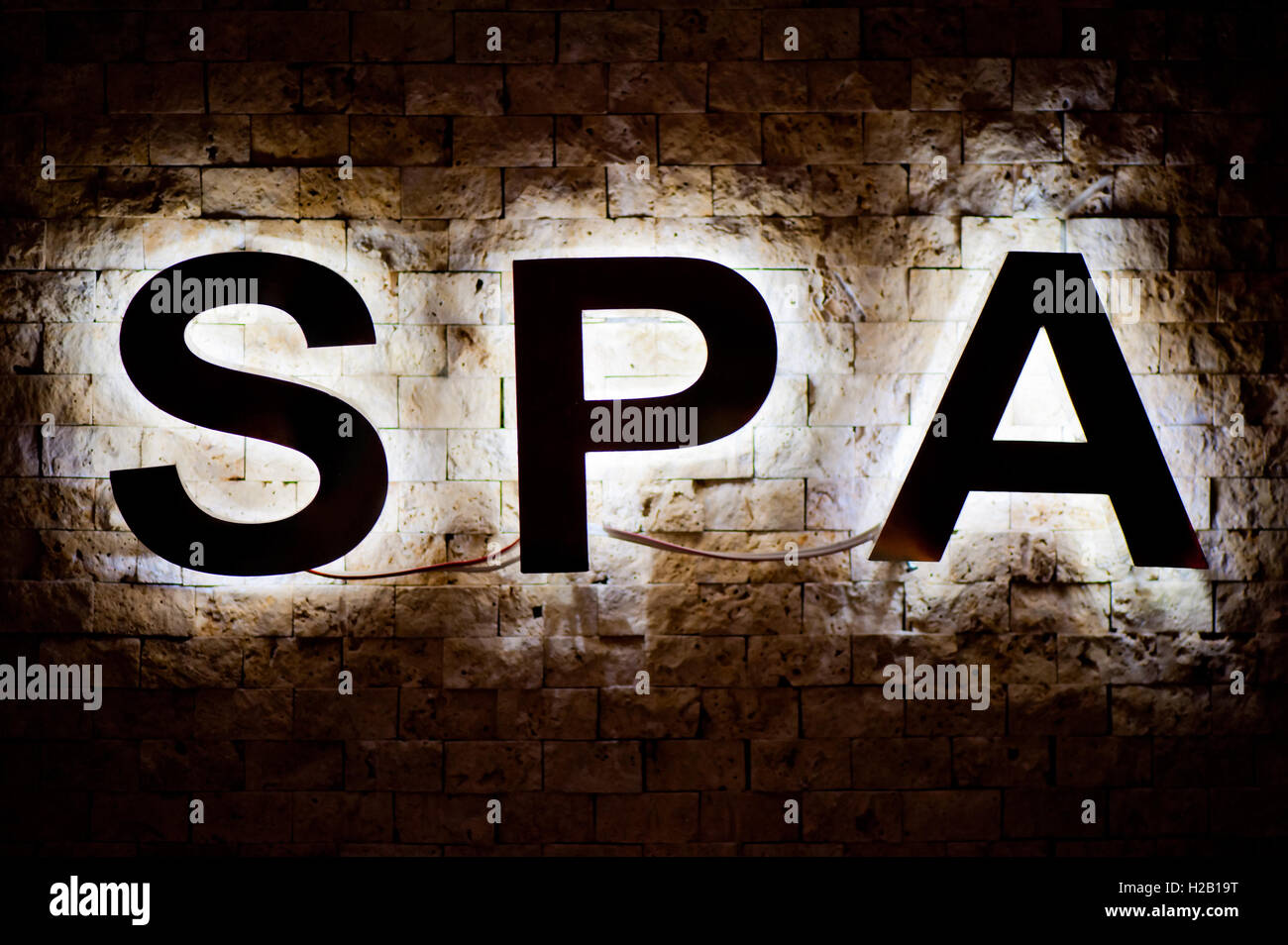 illuminated sign before entering the spa salon Stock Photo - Alamy