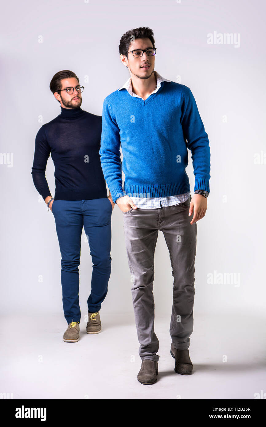 Two good-looking men in stylish clothes.Studio shot Stock Photo - Alamy