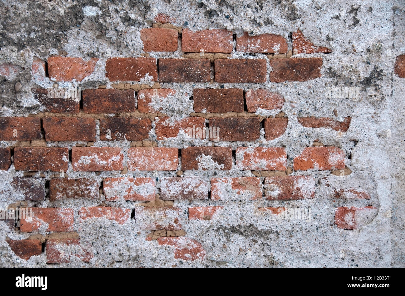 Rustic old brick wall with crusting of concrete on it Stock Photo - Alamy