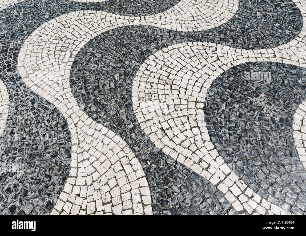 Wavy pattern in pavement, black and white, cobblestones, Rossio, Lisbon ...