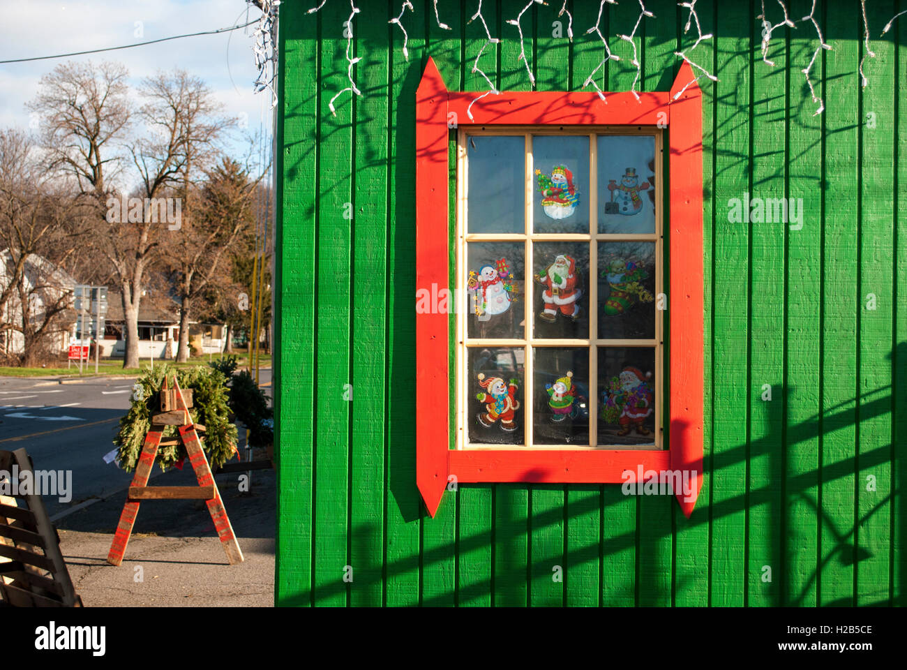 A bright green and red Christmas shack Stock Photo - Alamy