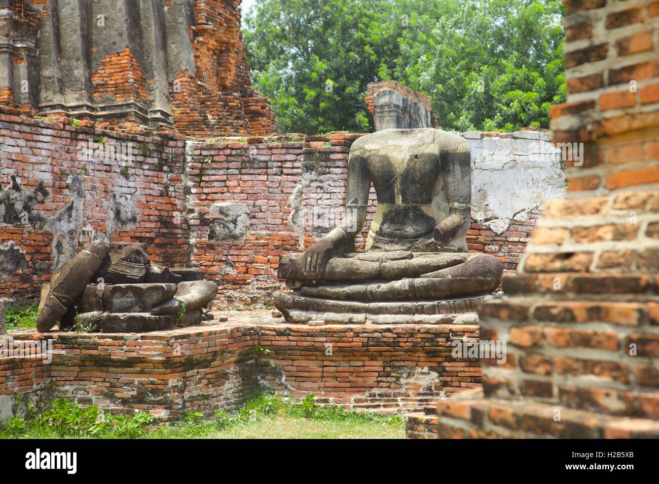 Damaged Buddhas at the old Siam capital city of Ayuttaya, Thailand ...