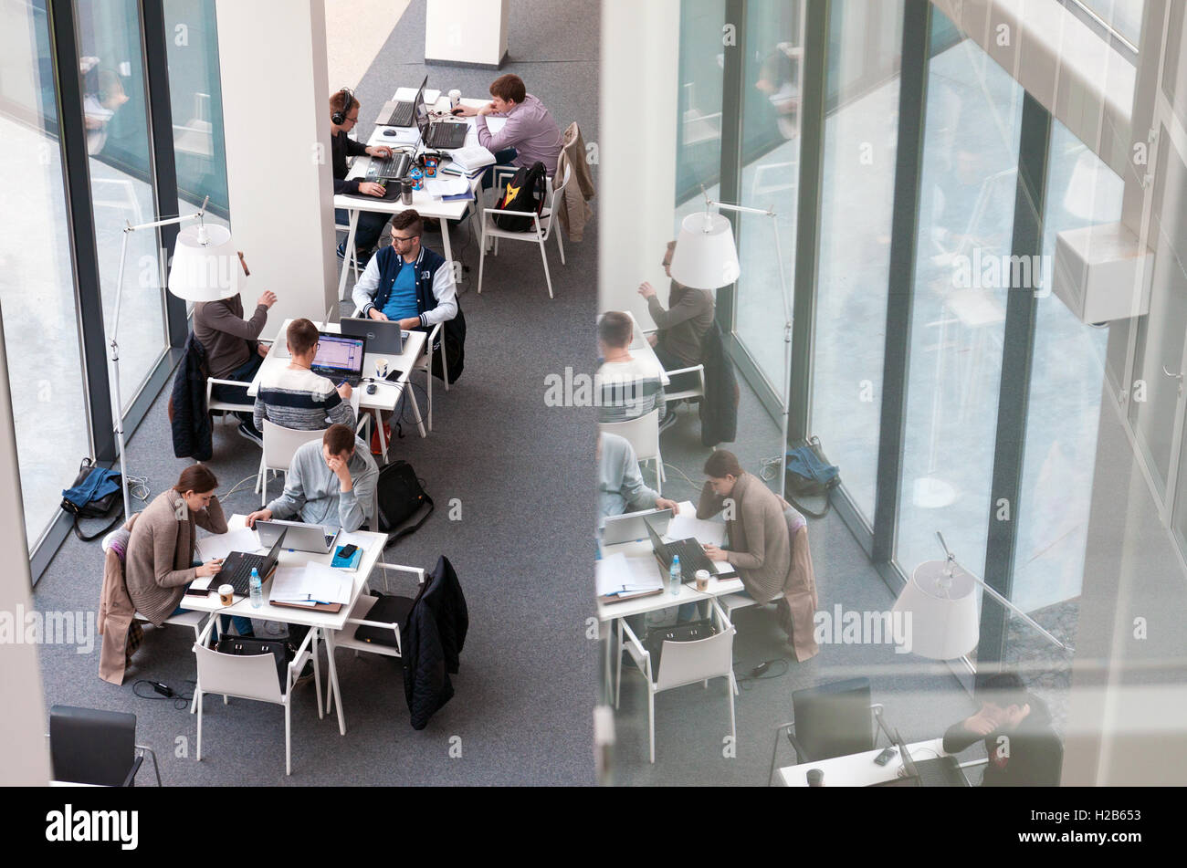 Students sitting and studying at Vilnius University library, Lithuania ...