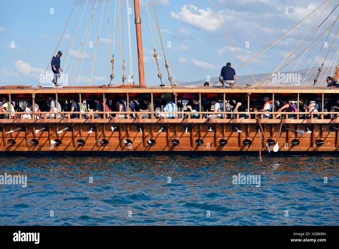Full scale copy of an ancient trireme with volunteer rowers in Faliro ...