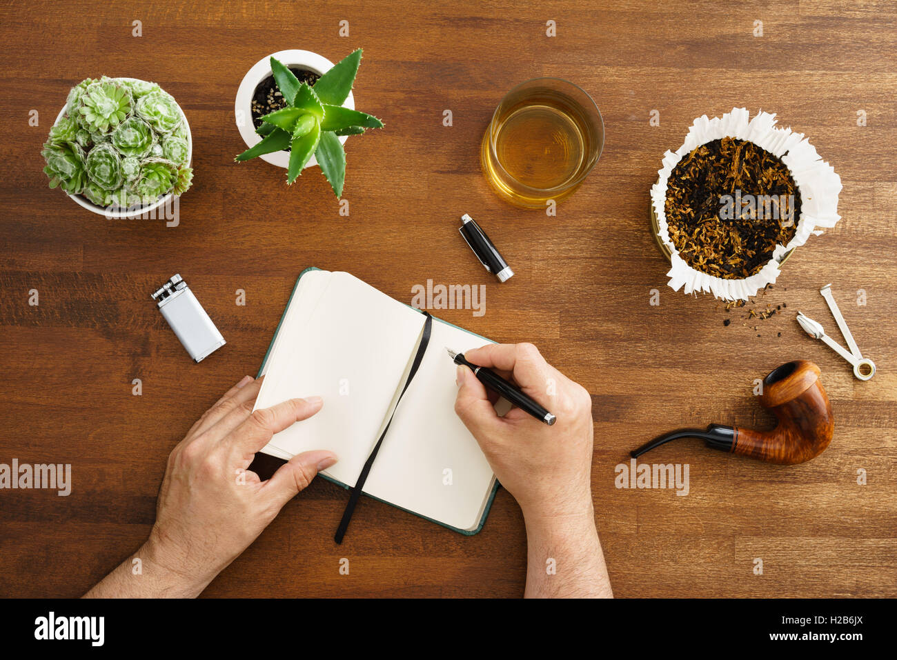 Desktop scene on wooden table Stock Photo - Alamy