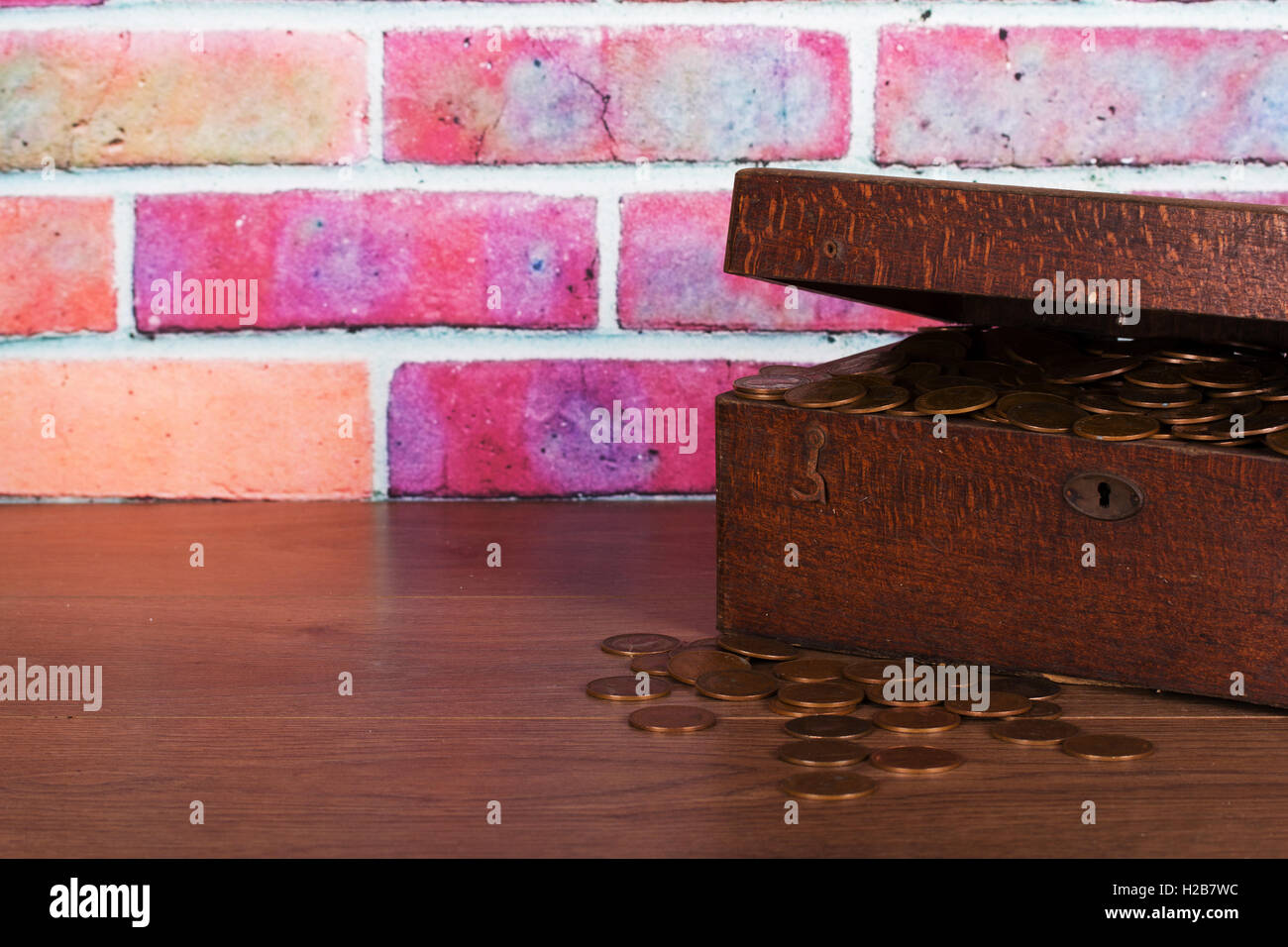 Old wooden chest filled with old copper coins Stock Photo - Alamy
