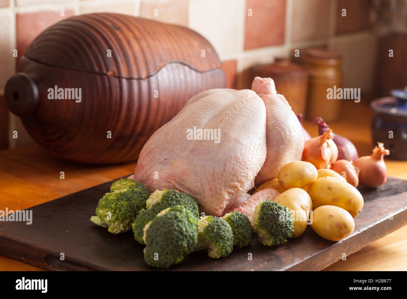 Chicken ready to cook in a clay brick Stock Photo - Alamy