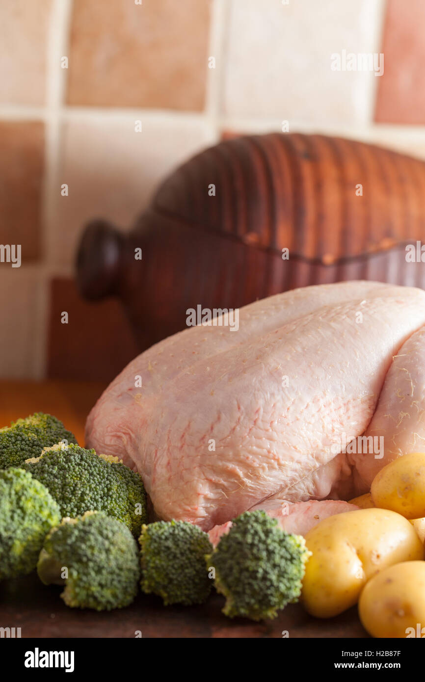 Chicken ready to cook in a clay brick Stock Photo - Alamy