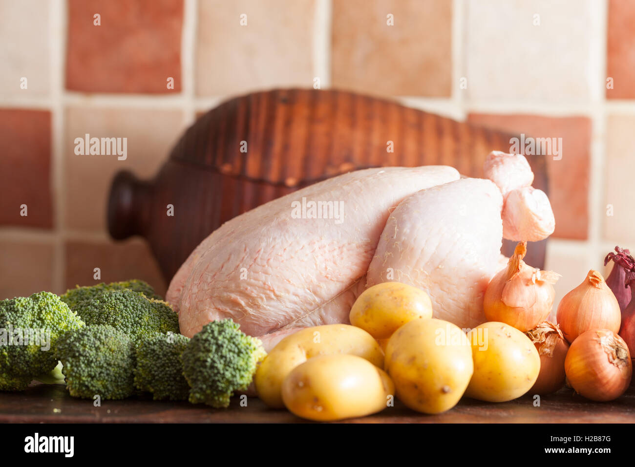 Chicken ready to cook in a clay brick Stock Photo - Alamy
