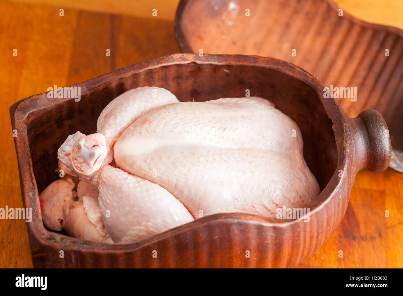 Chicken ready to cook in a clay brick Stock Photo - Alamy