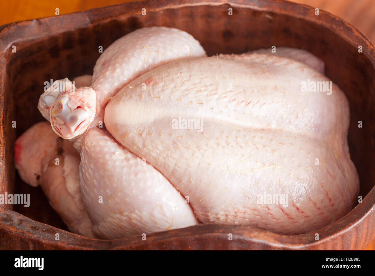 Chicken ready to cook in a clay brick Stock Photo - Alamy