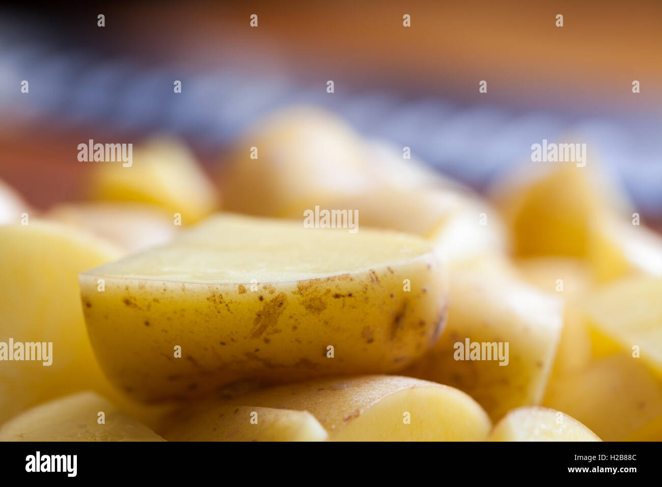 New potatoes sliced and ready Stock Photo - Alamy