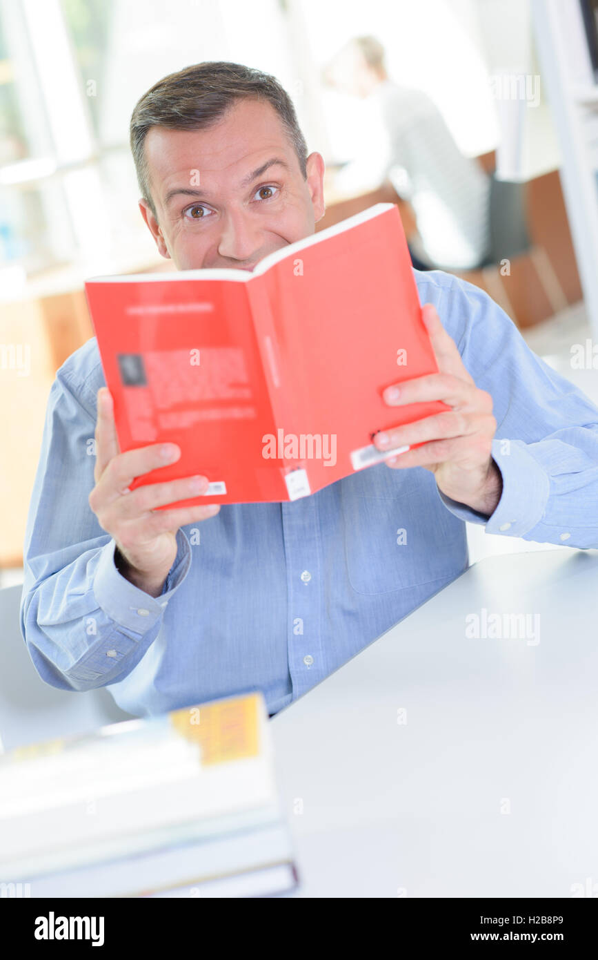 reading an intriguing story Stock Photo - Alamy