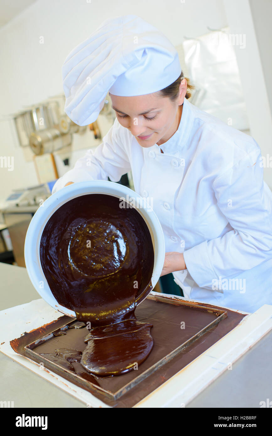 Chef pouring melted chocolate Stock Photo - Alamy