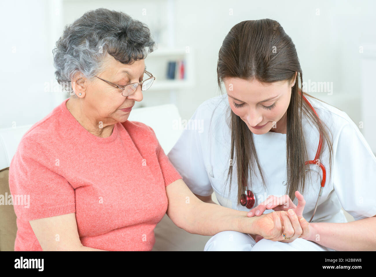 Nurse checking patients pulse hi-res stock photography and images - Alamy