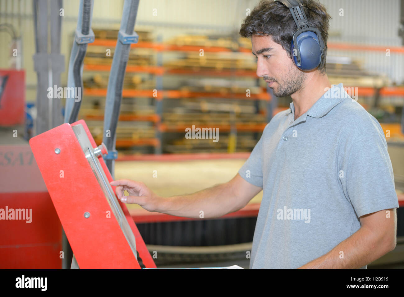factory operator with ear protection Stock Photo - Alamy