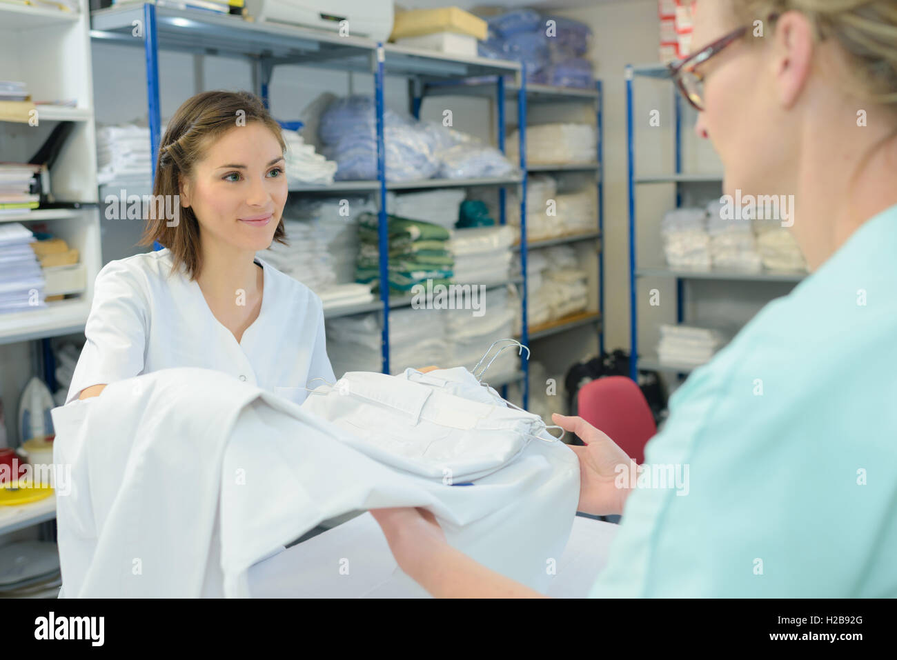 Cloth handling hi-res stock photography and images - Alamy