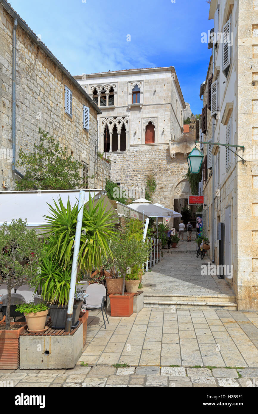 Narrow street leading from the Main Gate in the old city walls, Hvar ...
