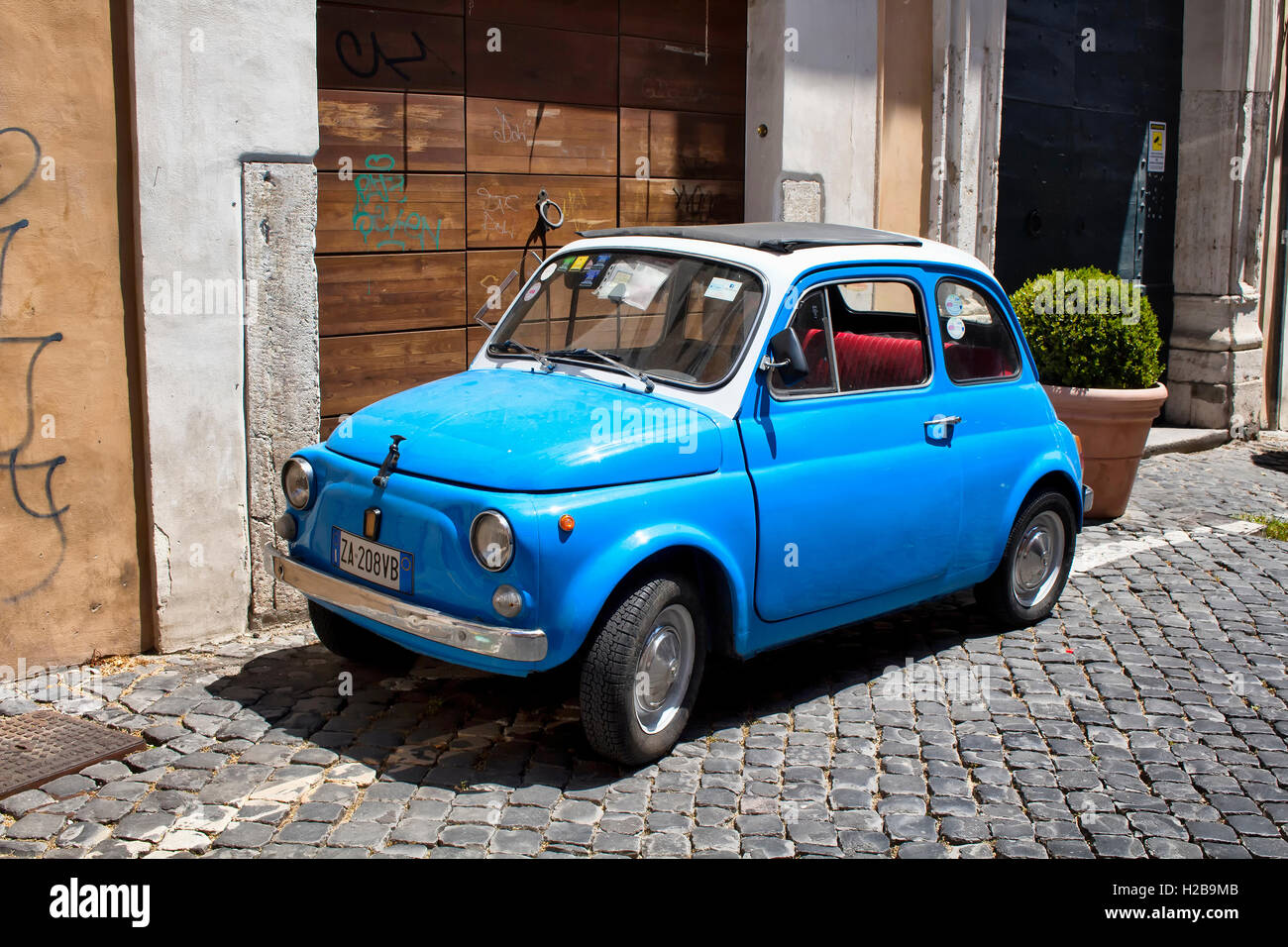 Retro, blue, little, old car parked on one of the streets in Trastevere ...