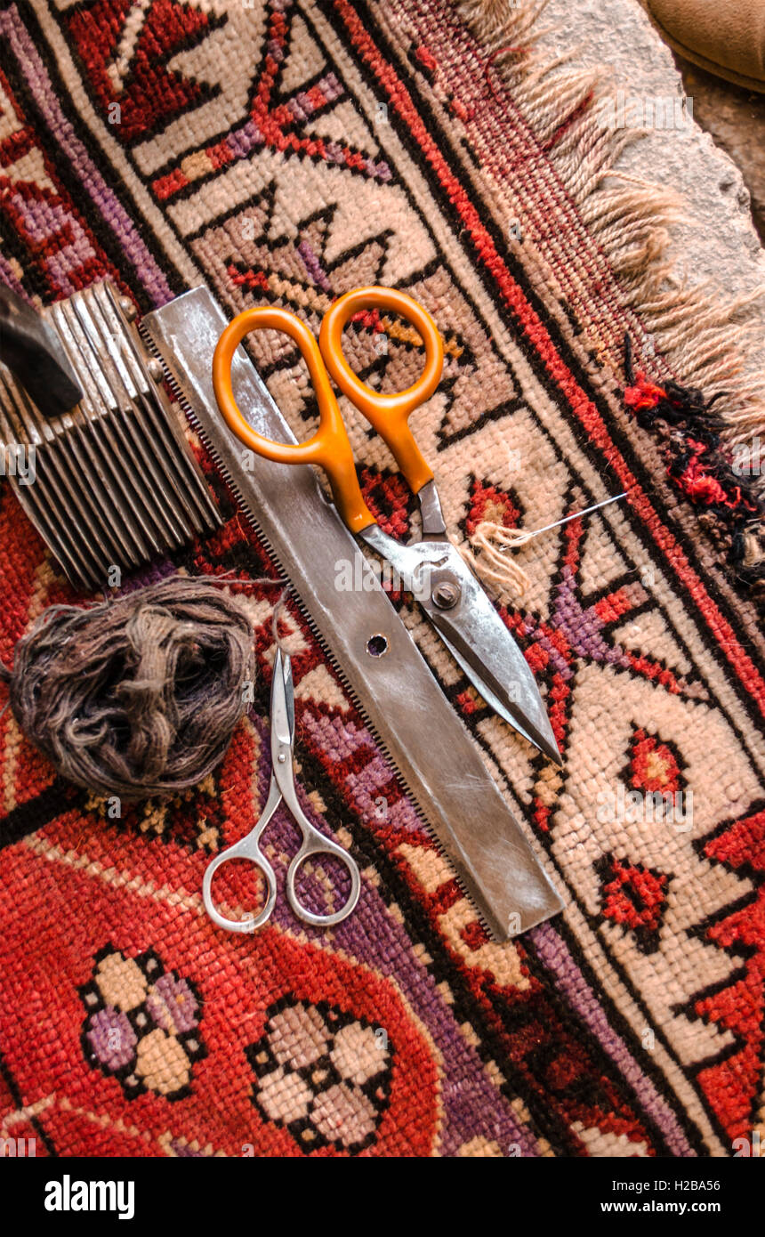 Worn edge of the old woolen carpet prepared for restoration Stock Photo ...