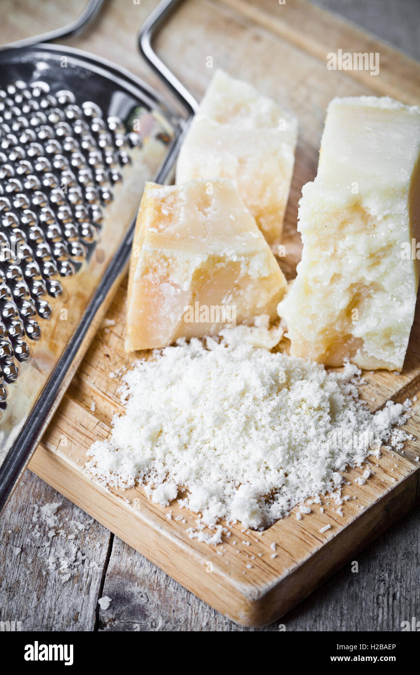 grated parmesan cheese and metal grater Stock Photo - Alamy