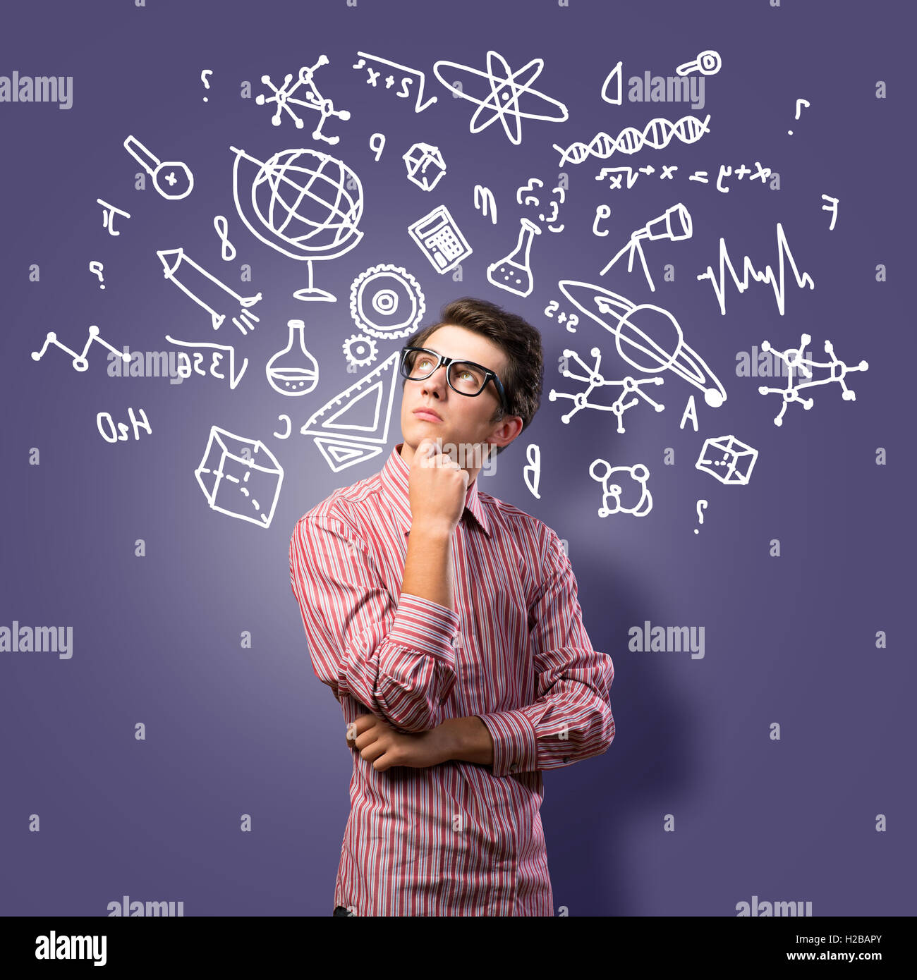 young man scientist with glasses thinking Stock Photo - Alamy