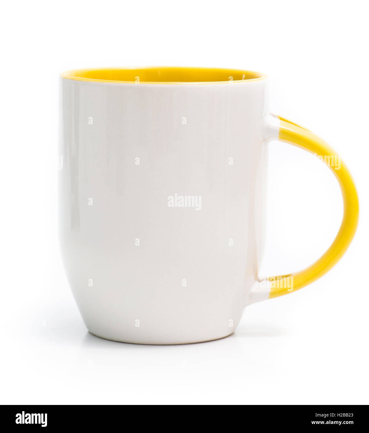 white cup with a yellow handle Stock Photo - Alamy