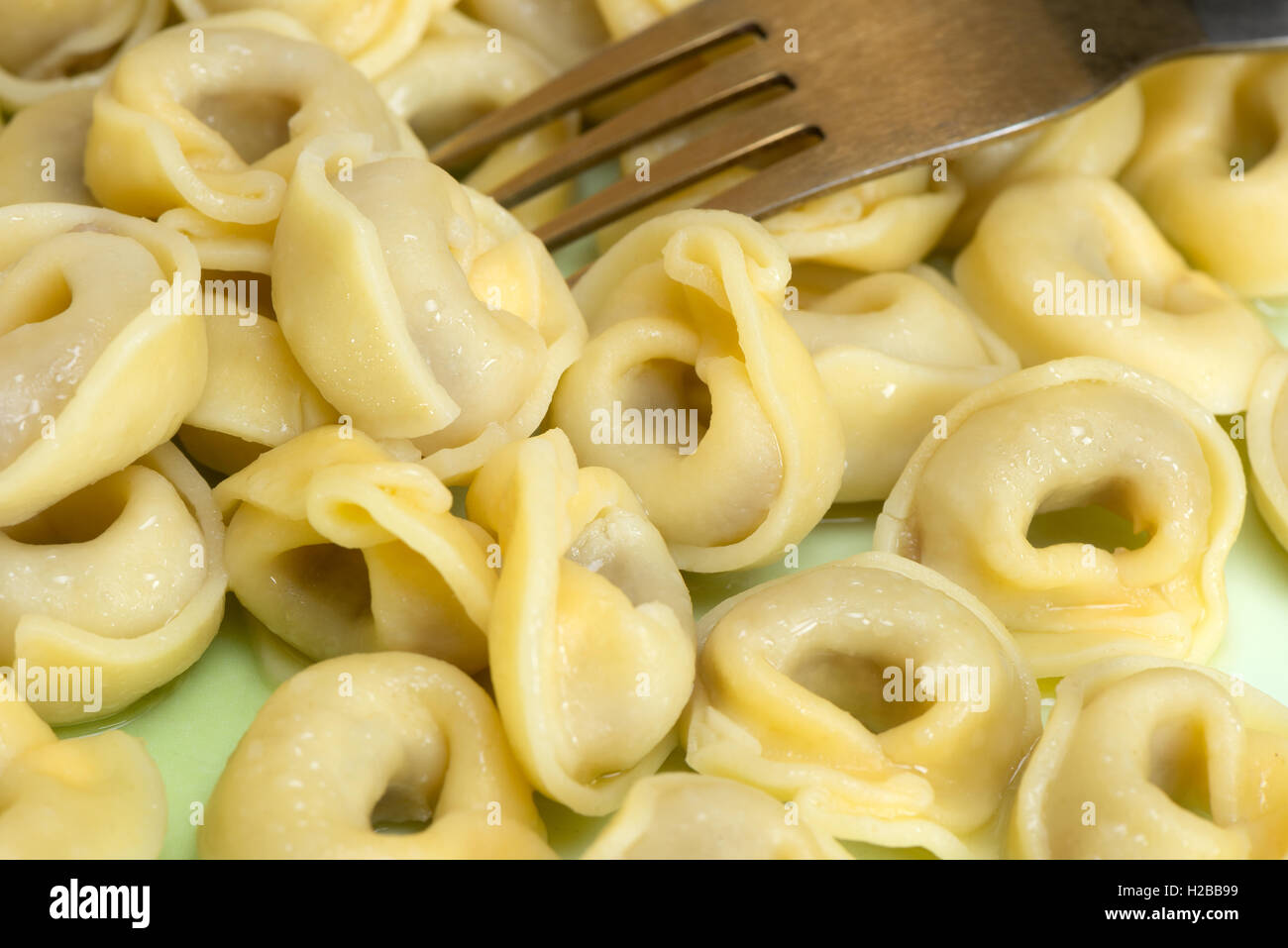 Tortellini - Italian ring-shaped pasta stuffed with a meat or cheese ...