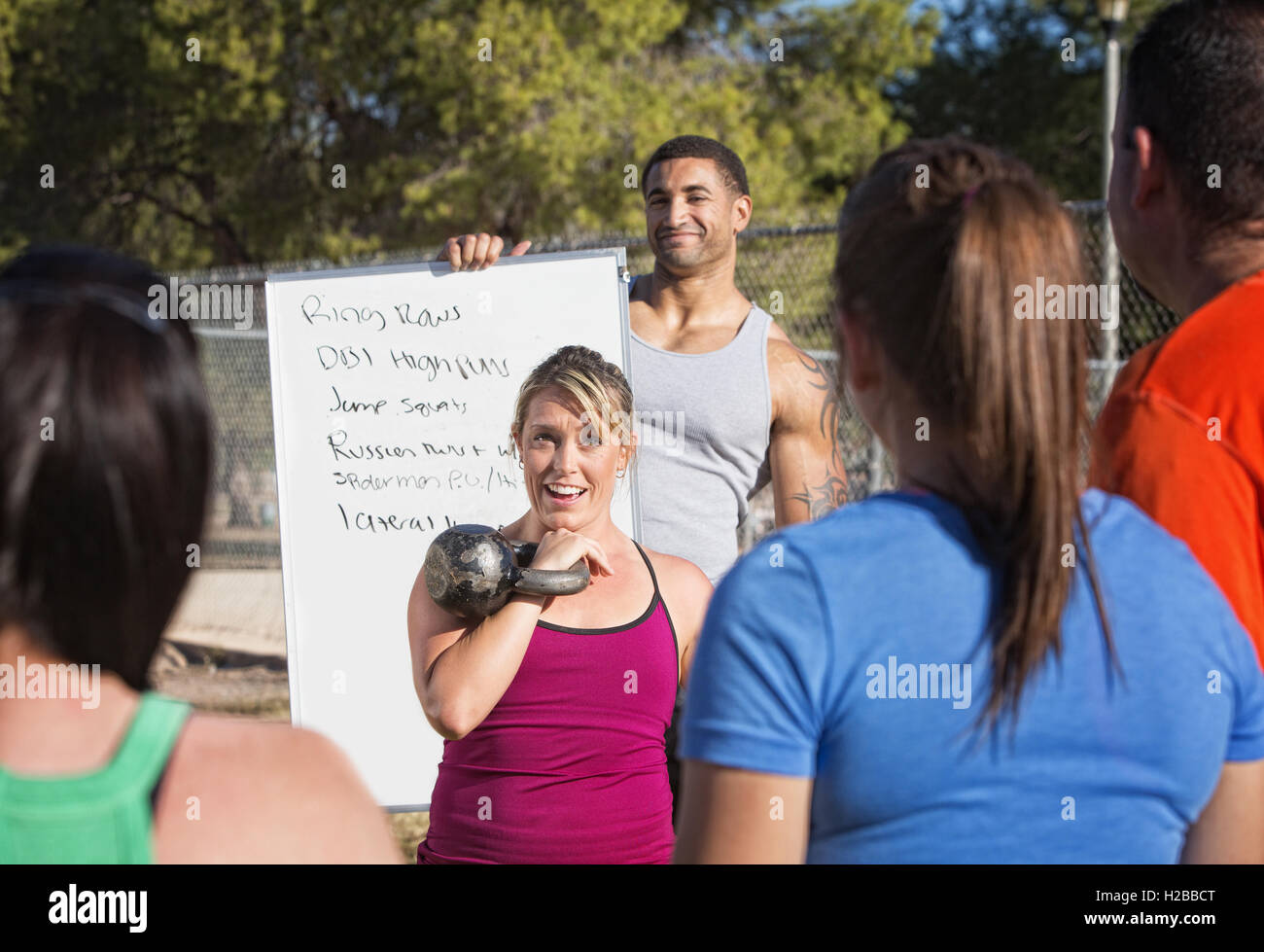 Fitness Instructors with List of Exercises Stock Photo - Alamy
