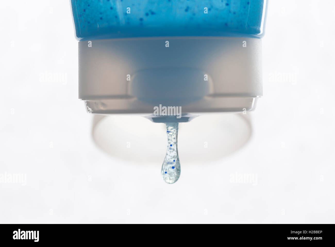 Tube of face scrub containing microbeads. Blue tube on a white ...