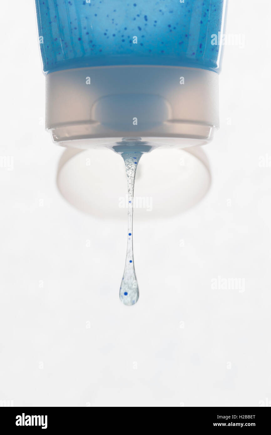 Tube of face scrub containing microbeads. Blue tube on a white ...