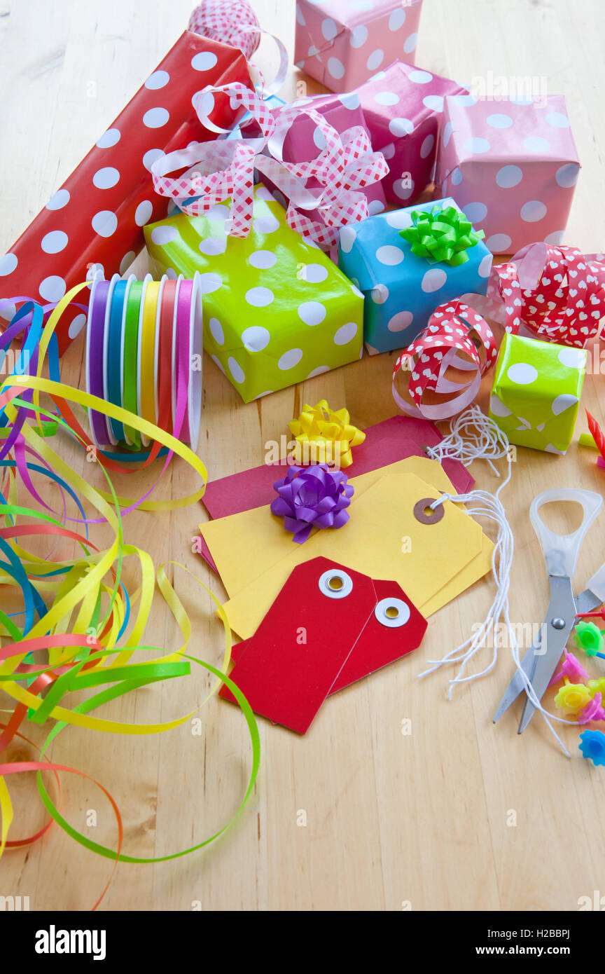 Colorful gift boxes wrapped in dotted paper Stock Photo - Alamy