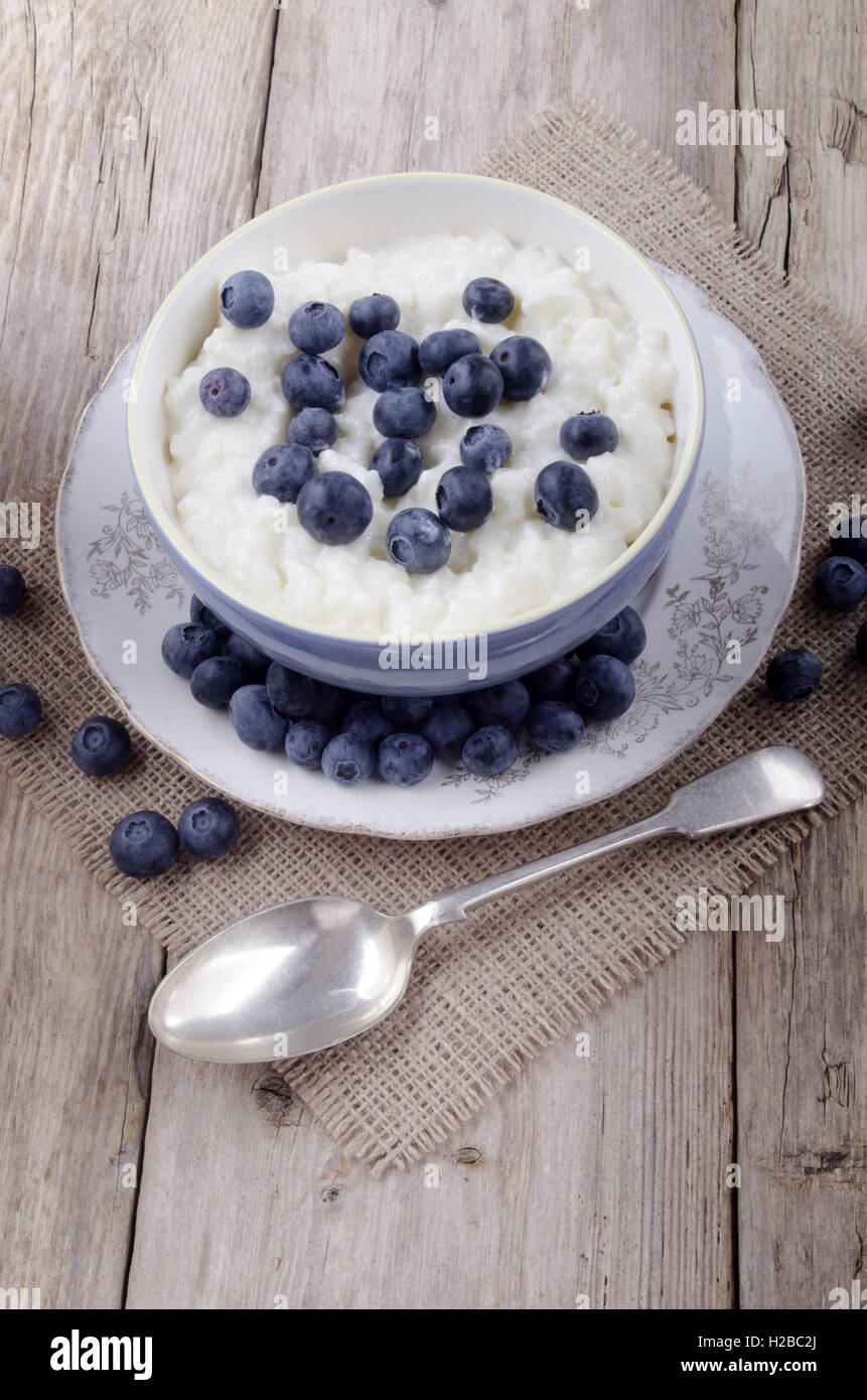 rice pudding and blueberries in a bowl Stock Photo - Alamy