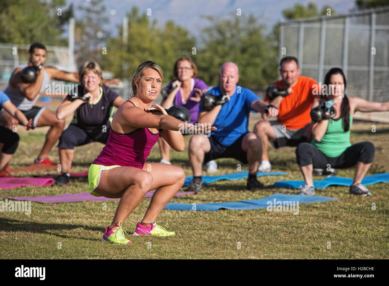 Mixed Group Doing Boot Camp Exercise Stock Photo - Alamy