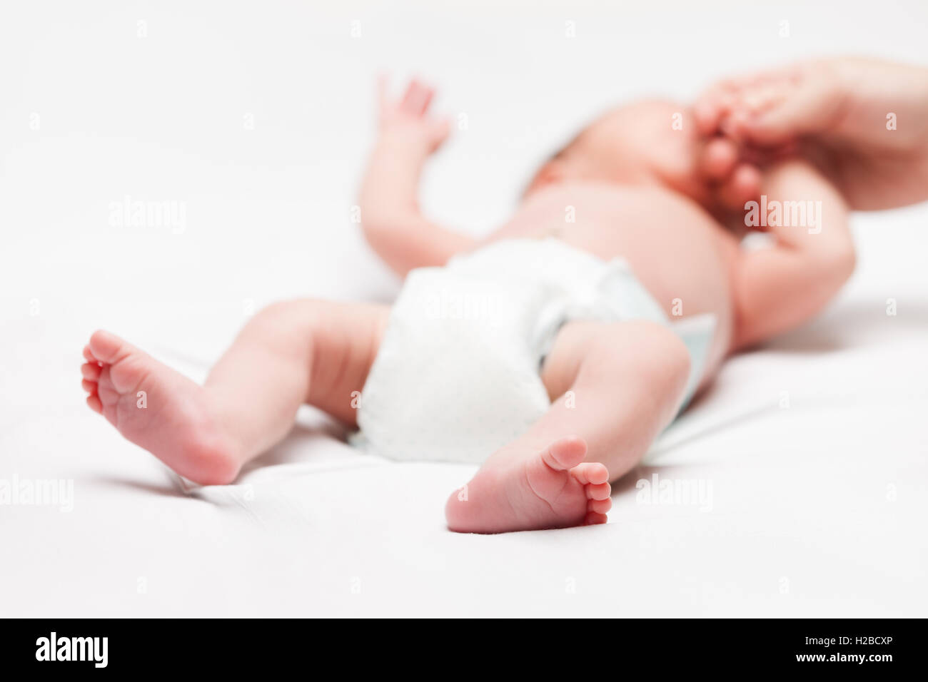 Cute sleeping newborn baby child holding mother hand Stock Photo - Alamy