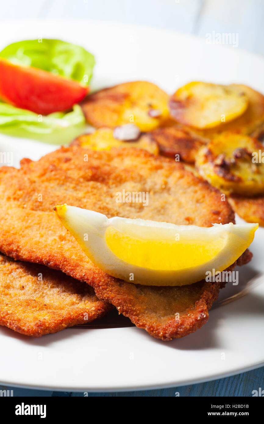 wiener schnitzel with roasted potatoes Stock Photo - Alamy
