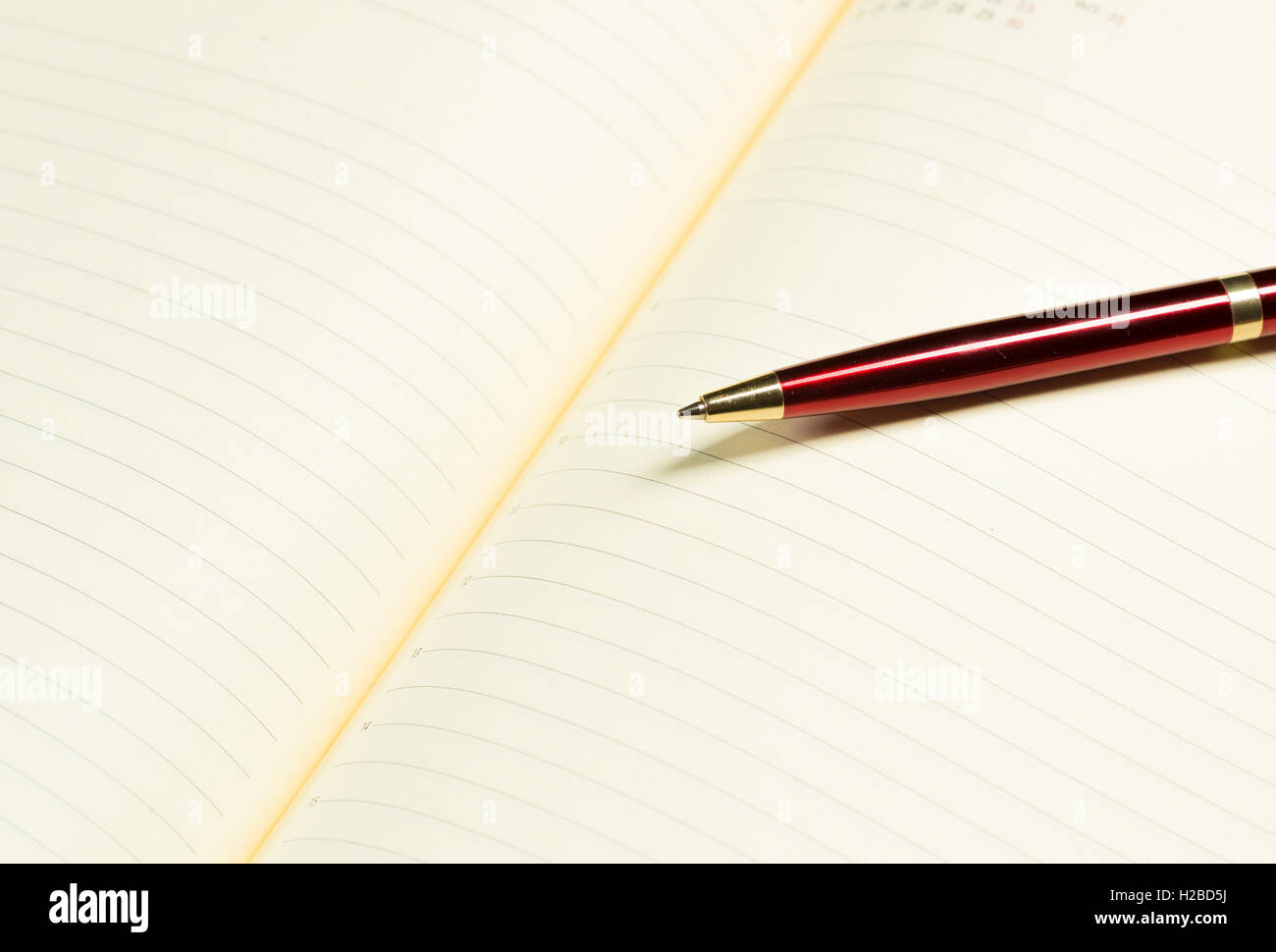 pen and open notepad Stock Photo - Alamy