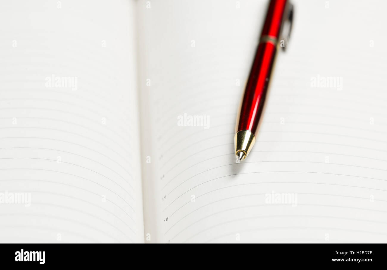 pen and open notepad Stock Photo - Alamy