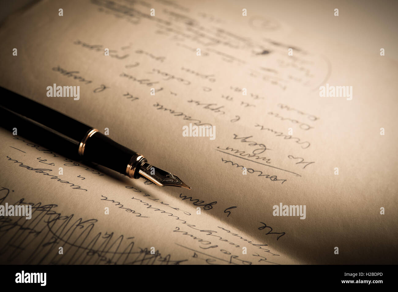 fountain pen on text sheet paper 2 Stock Photo - Alamy