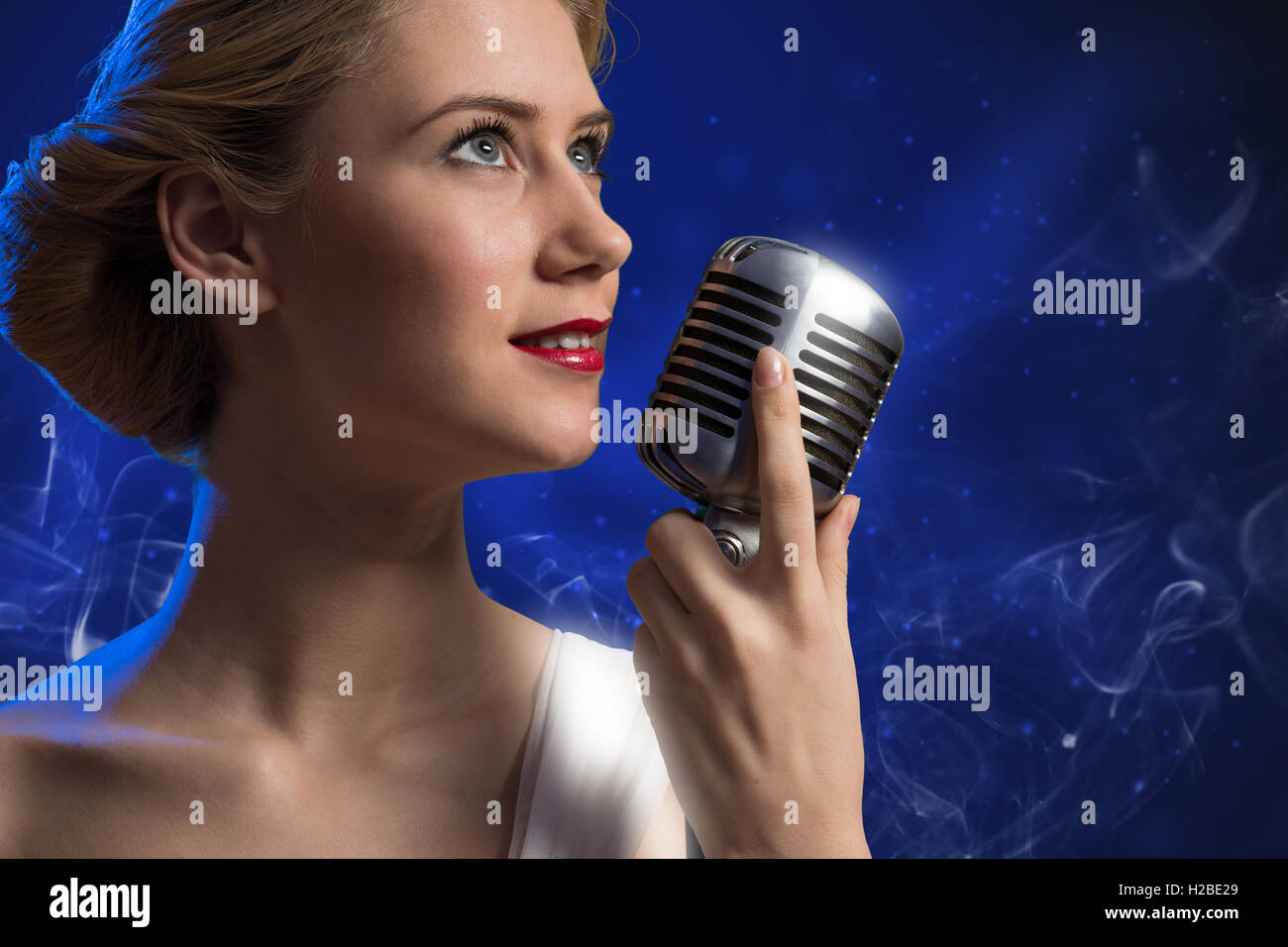attractive female singer with microphone Stock Photo - Alamy