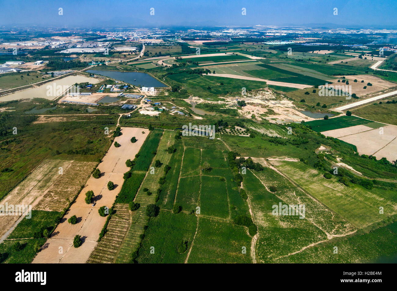Farming and construction in industrial estate development Aerial photo ...