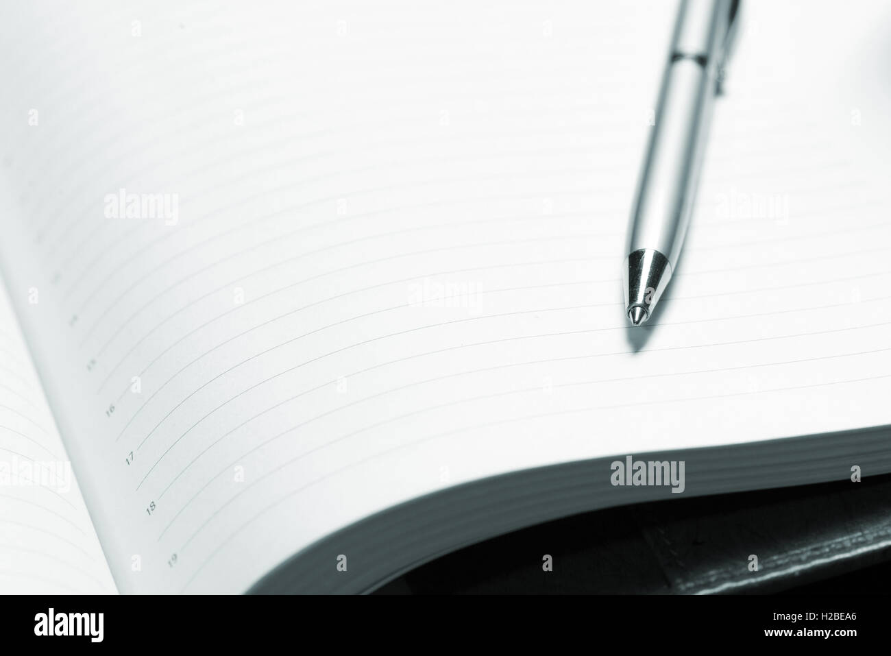 pen and open notepad Stock Photo - Alamy