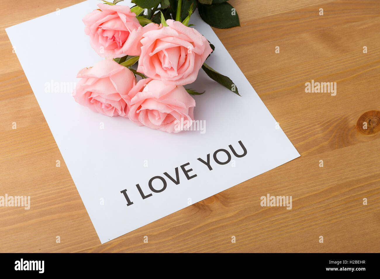 Pink rose with message of I Love You Stock Photo - Alamy