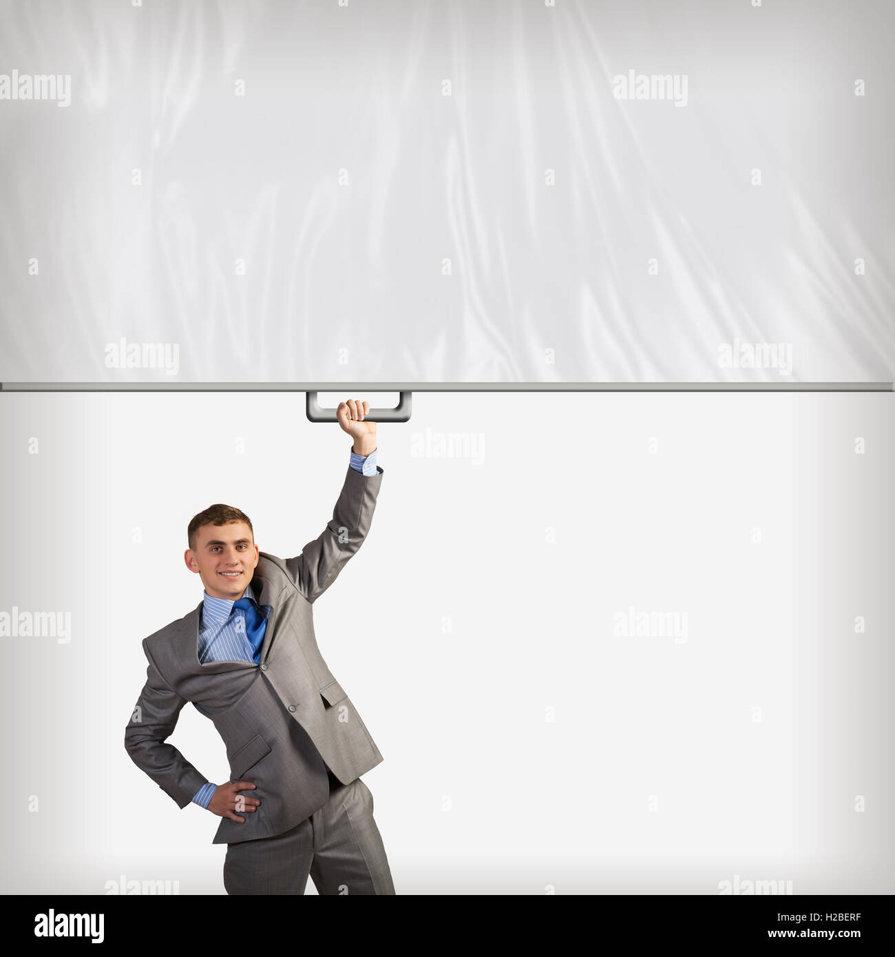 businessman holding a banner with one hand Stock Photo - Alamy