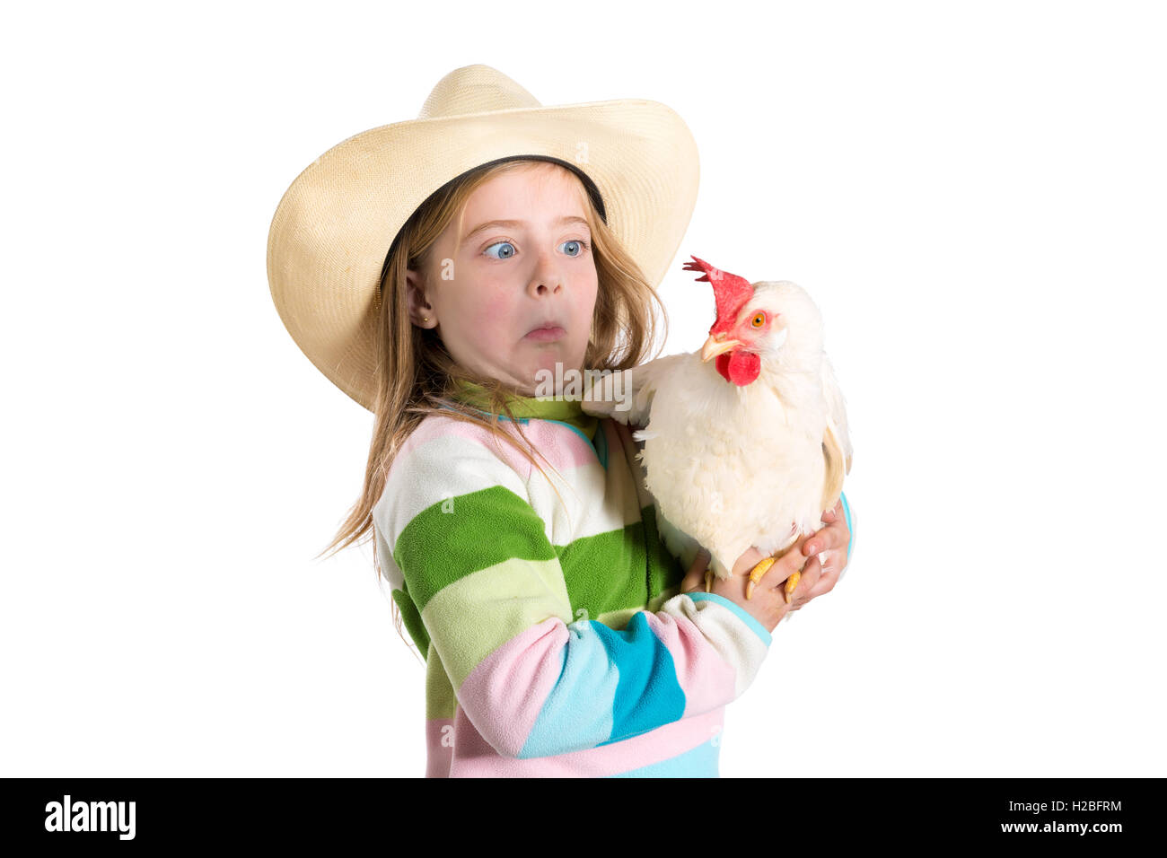 Funny kid girl expression surprised gesture scared of hen Stock Photo ...