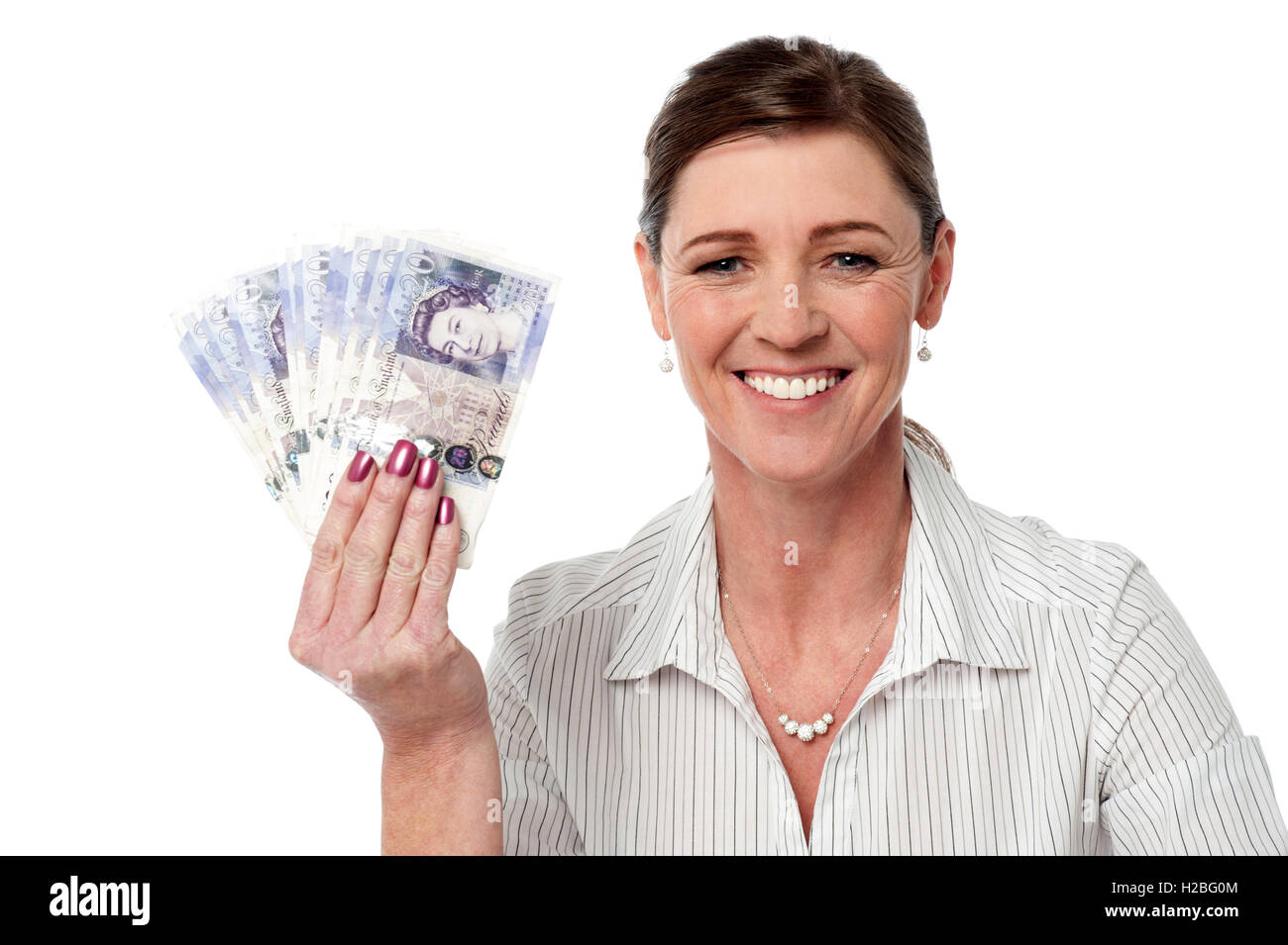 Business woman holding fan of currency notes Stock Photo - Alamy