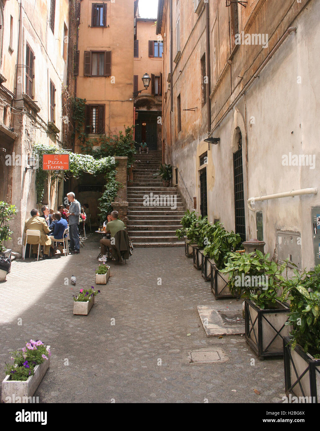 Tiny pizzzeria cafe in a Roman side street Stock Photo - Alamy