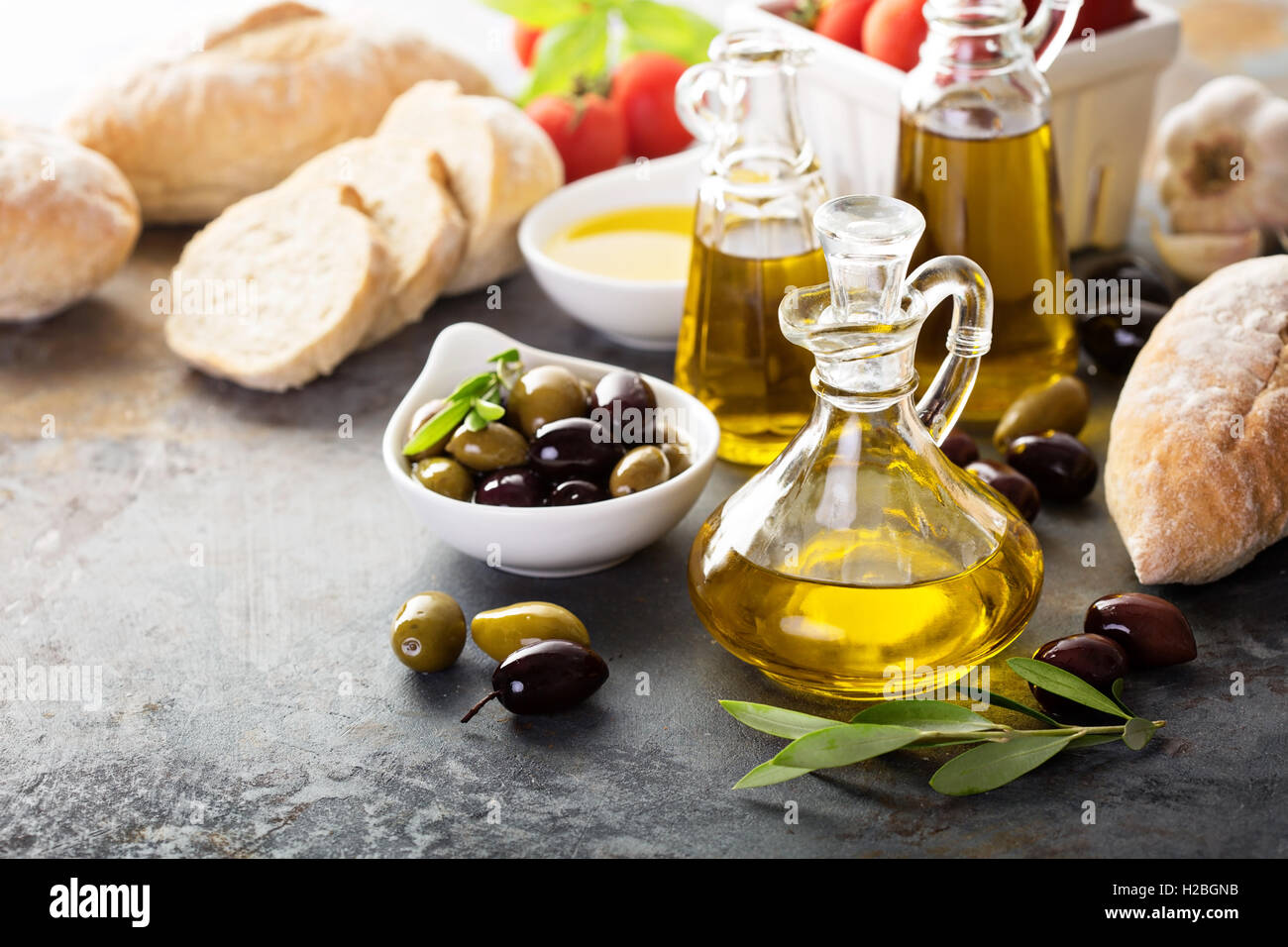 Olive oil in vintage bottles and italian cuisine ingredients Stock ...